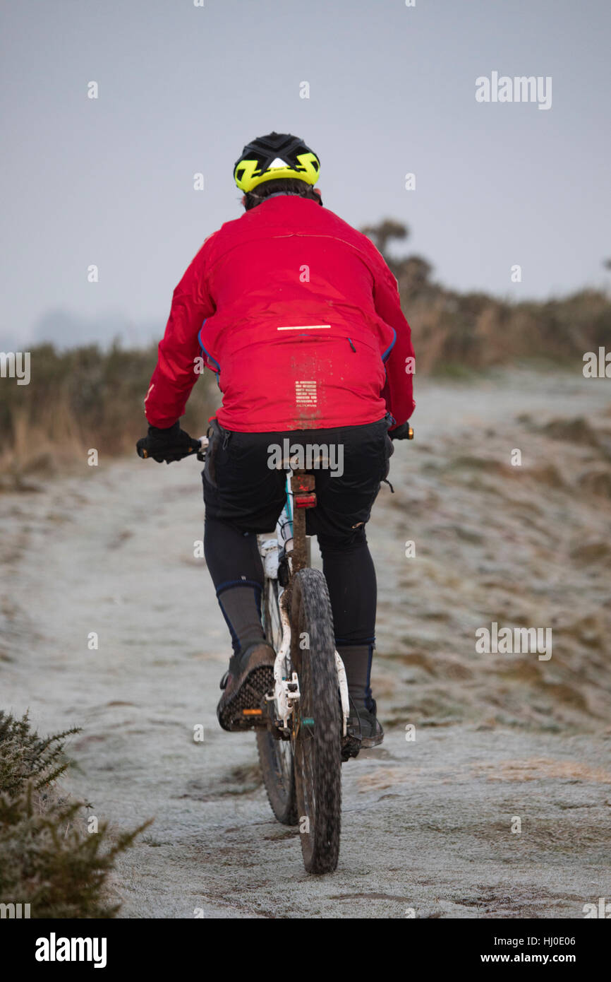 A mountain biker braving the freezing temperatures during a morning ...