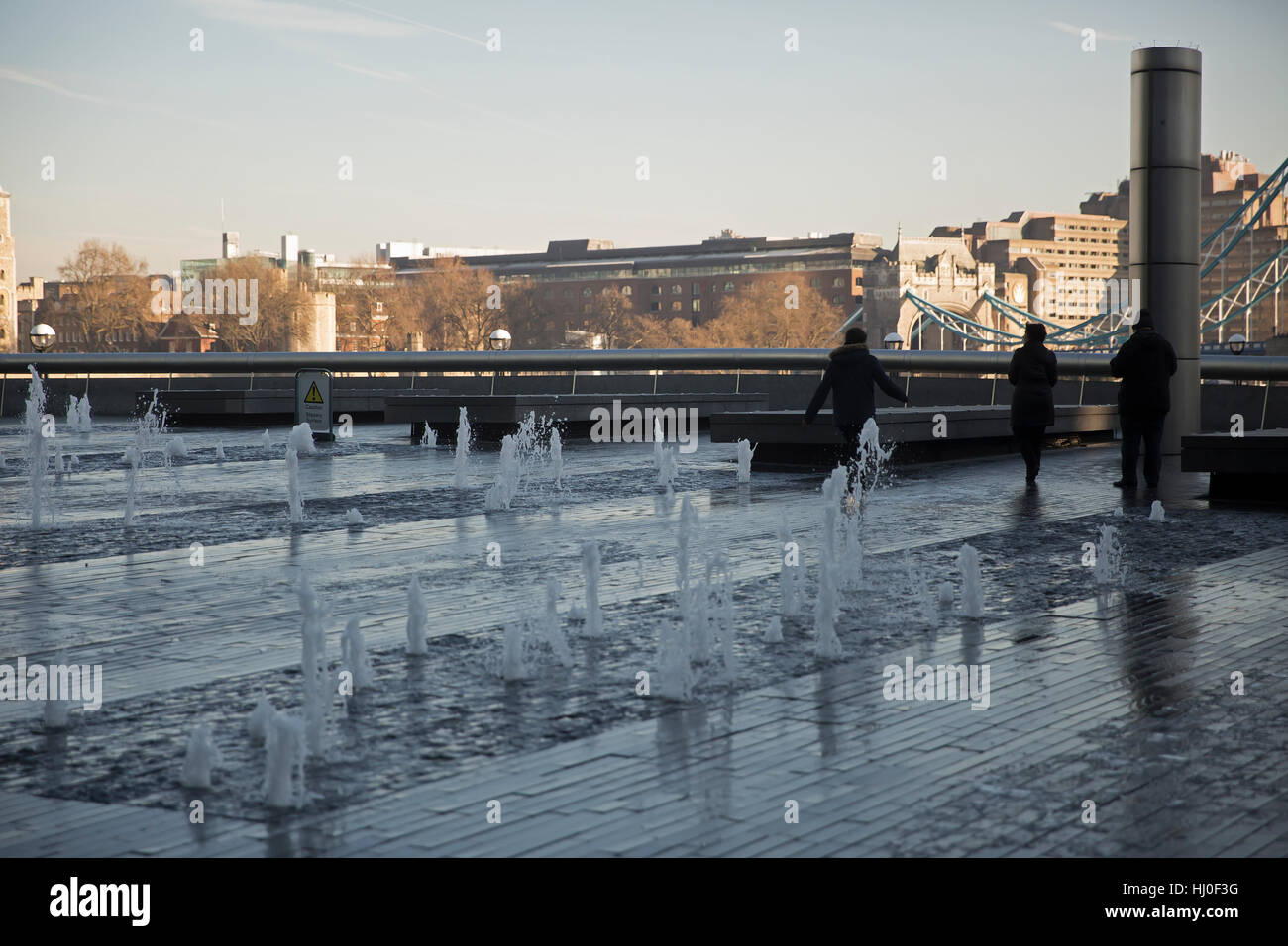 Water fountains create ice by the River Thames in London on a cold ...