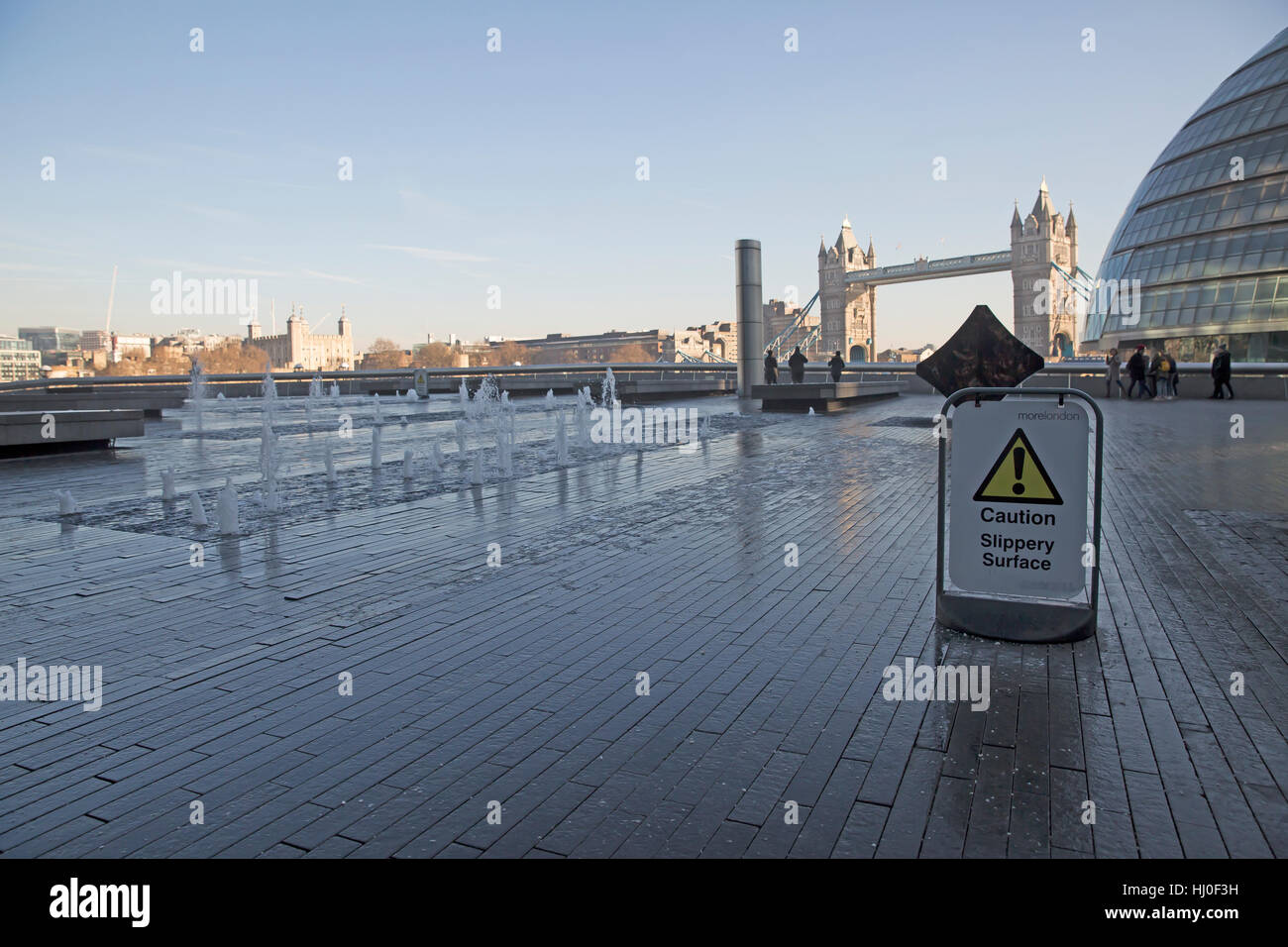 Water fountains create ice by the River Thames in London on a cold ...