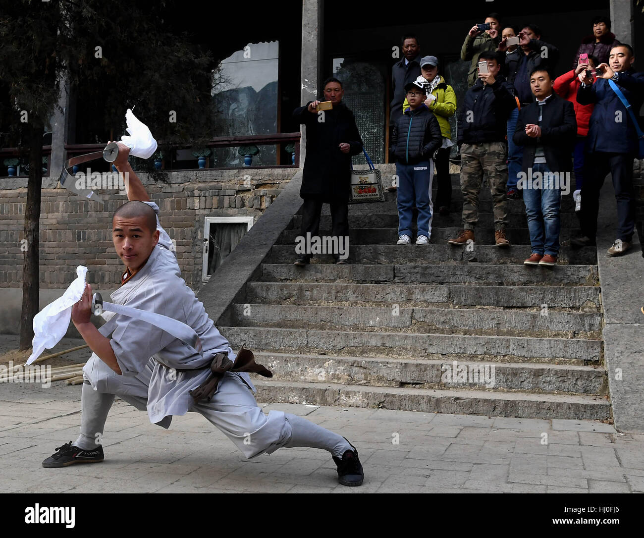 Zhengzhou. 20th Jan, 2017. A monk practices martial arts at Shaolin ...