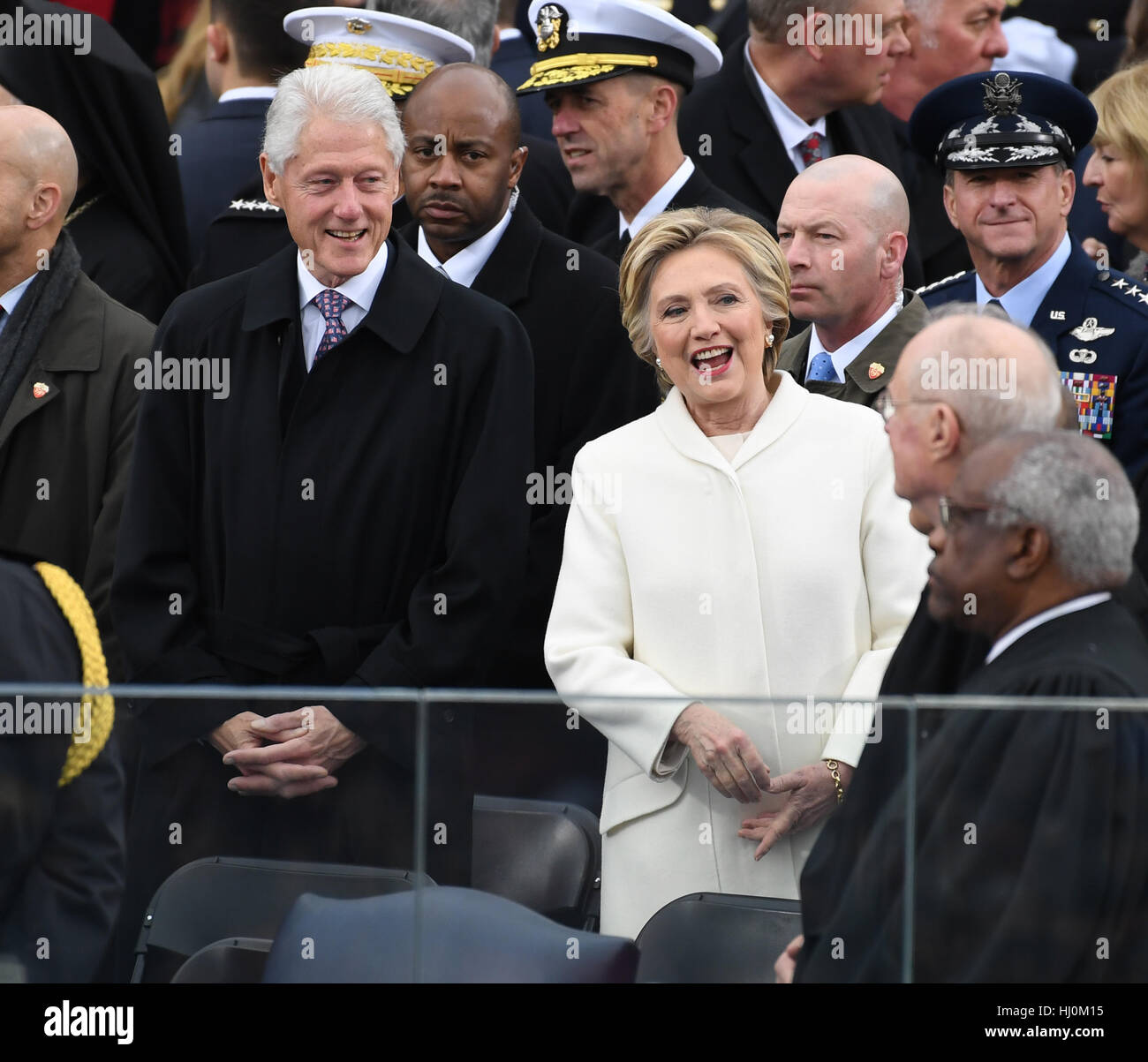 Former President Bill Clinton (L) and Hillary Clinton greet guests at ...