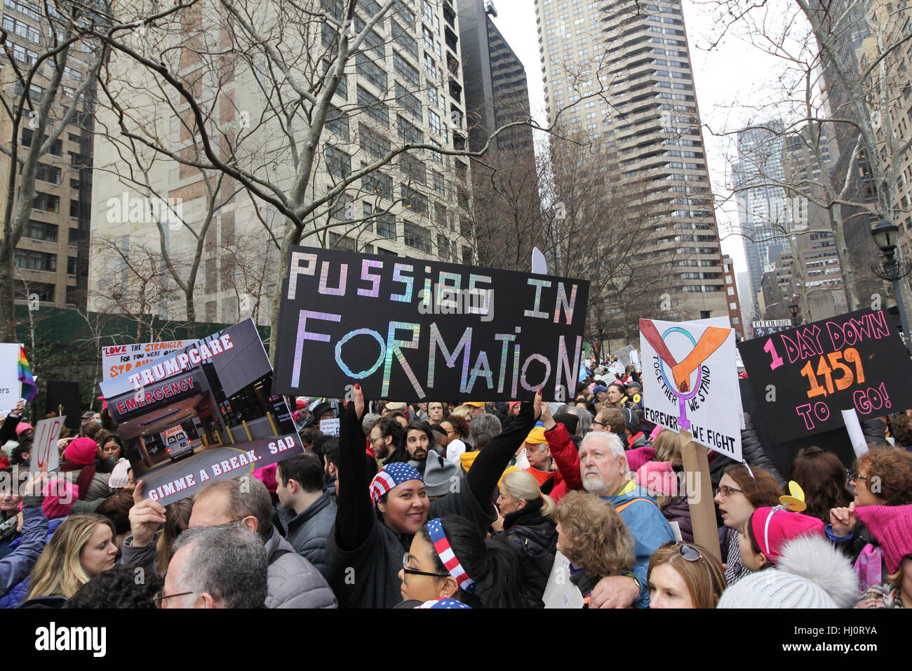 Group walking people holding signs hi-res stock photography and images ...
