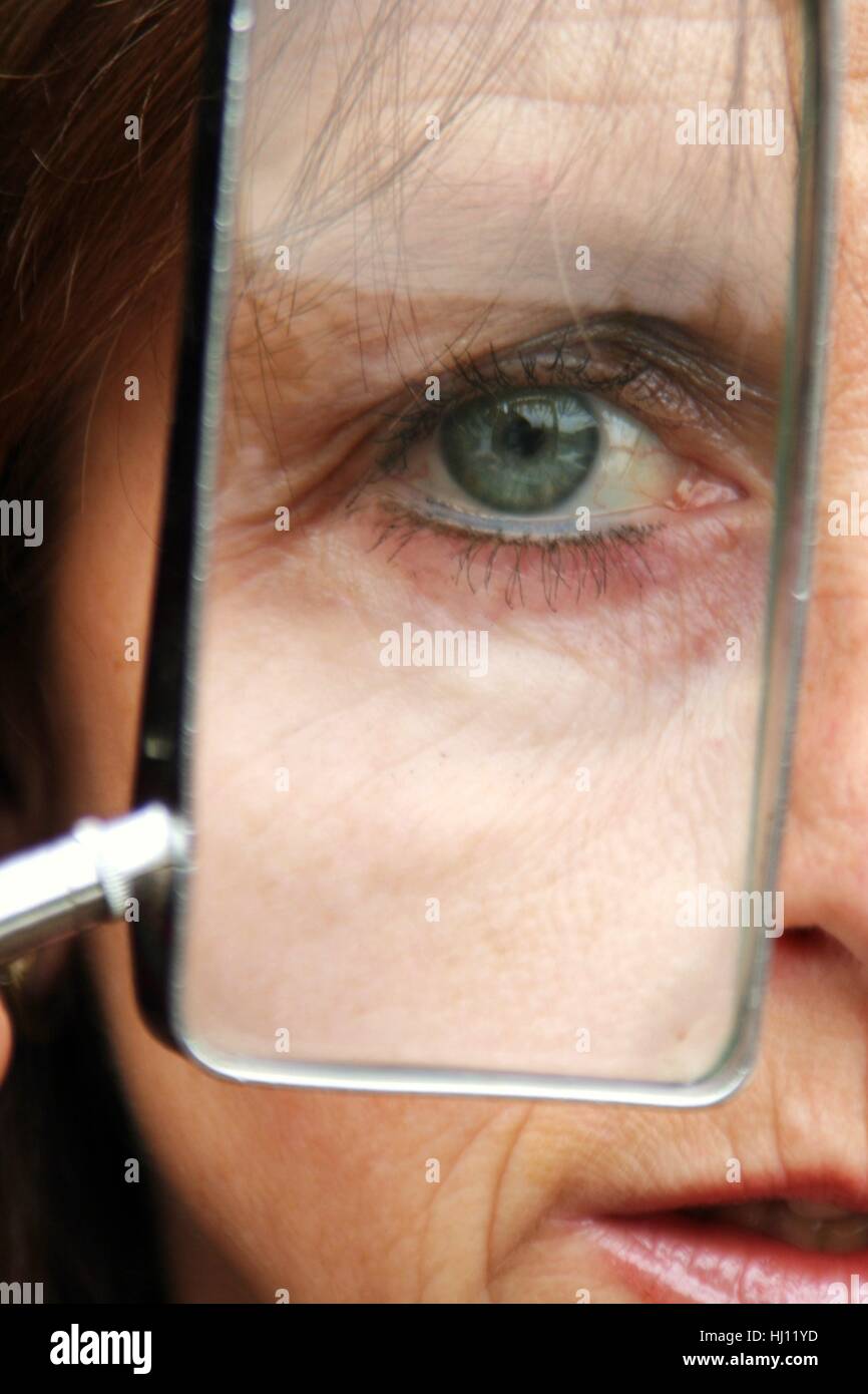 eye behind a magnifying glass Stock Photo - Alamy