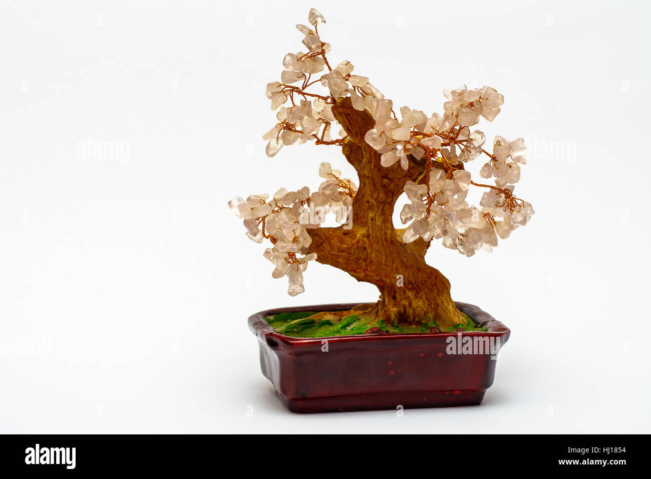 Happiness tree in a brown pot on a white background Stock Photo - Alamy