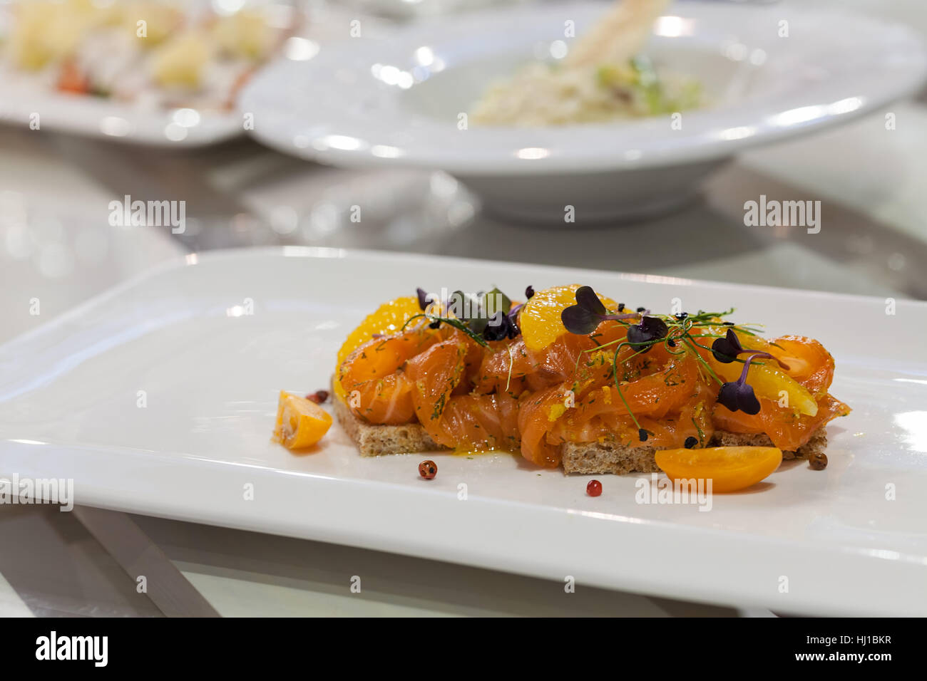 Bruschetta with salmon and Cherry tomato on white plate, note shallow ...