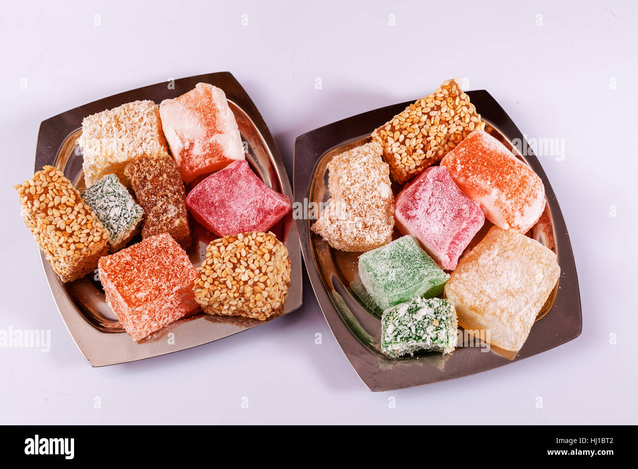 turkish delight on the small plates for dessert on the white background ...