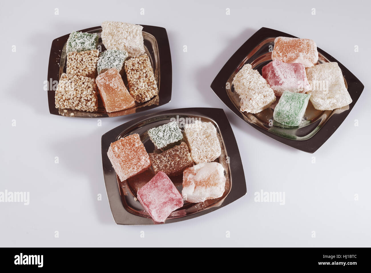 turkish delight on the small plates for dessert on the white background ...