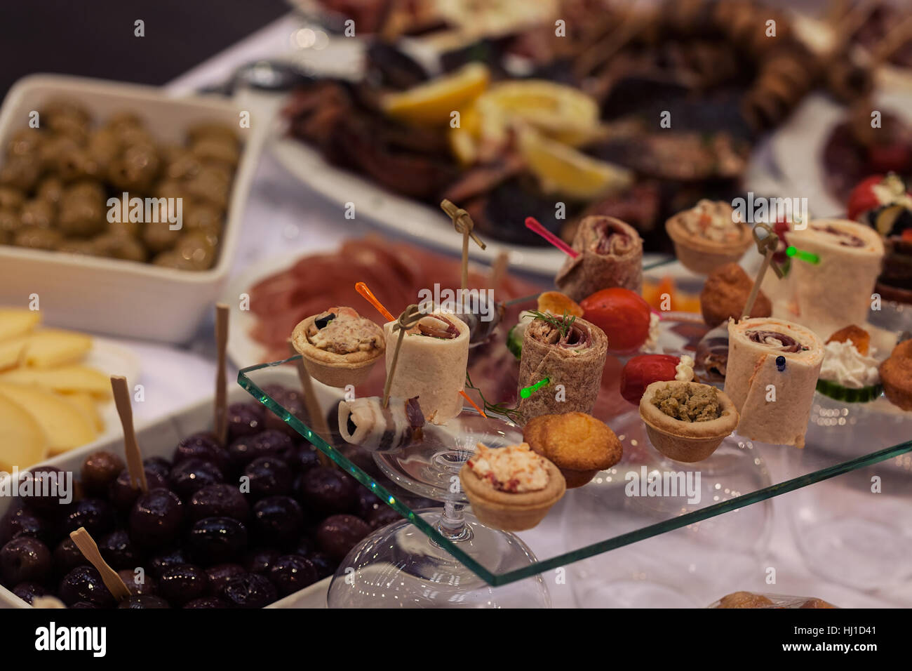 types of canapes for cocktails on a glass plate, note shallow depth of ...