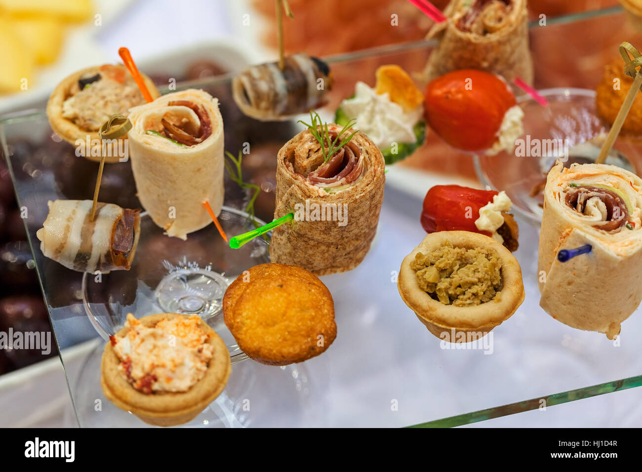types of canapes for cocktails on a glass plate, note shallow depth of ...