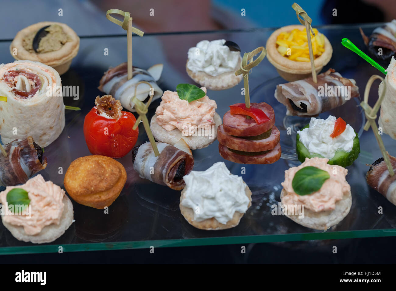 types of canapes for cocktails on a glass plate, note shallow depth of ...