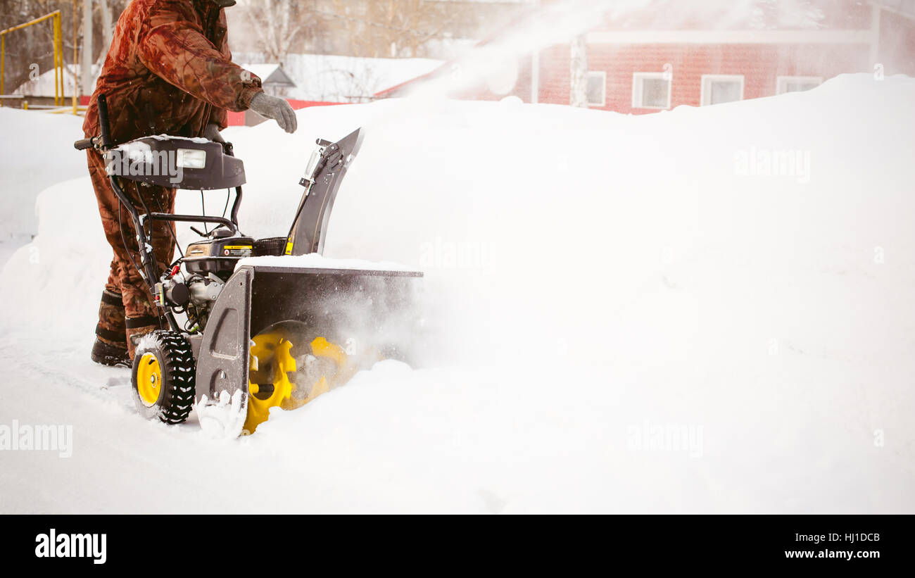 Man using snow blower clear hi-res stock photography and images - Alamy