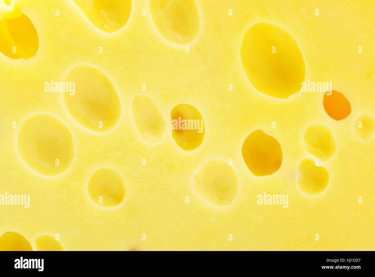 Background image of a large block of cheese Stock Photo - Alamy