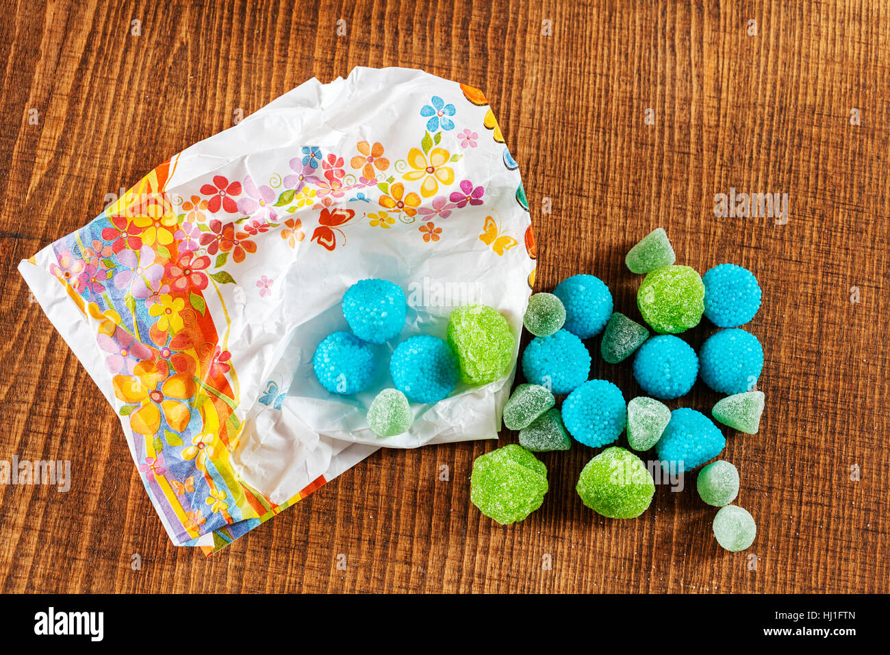 blue and green sweets from paper bags, note shallow depth of field ...