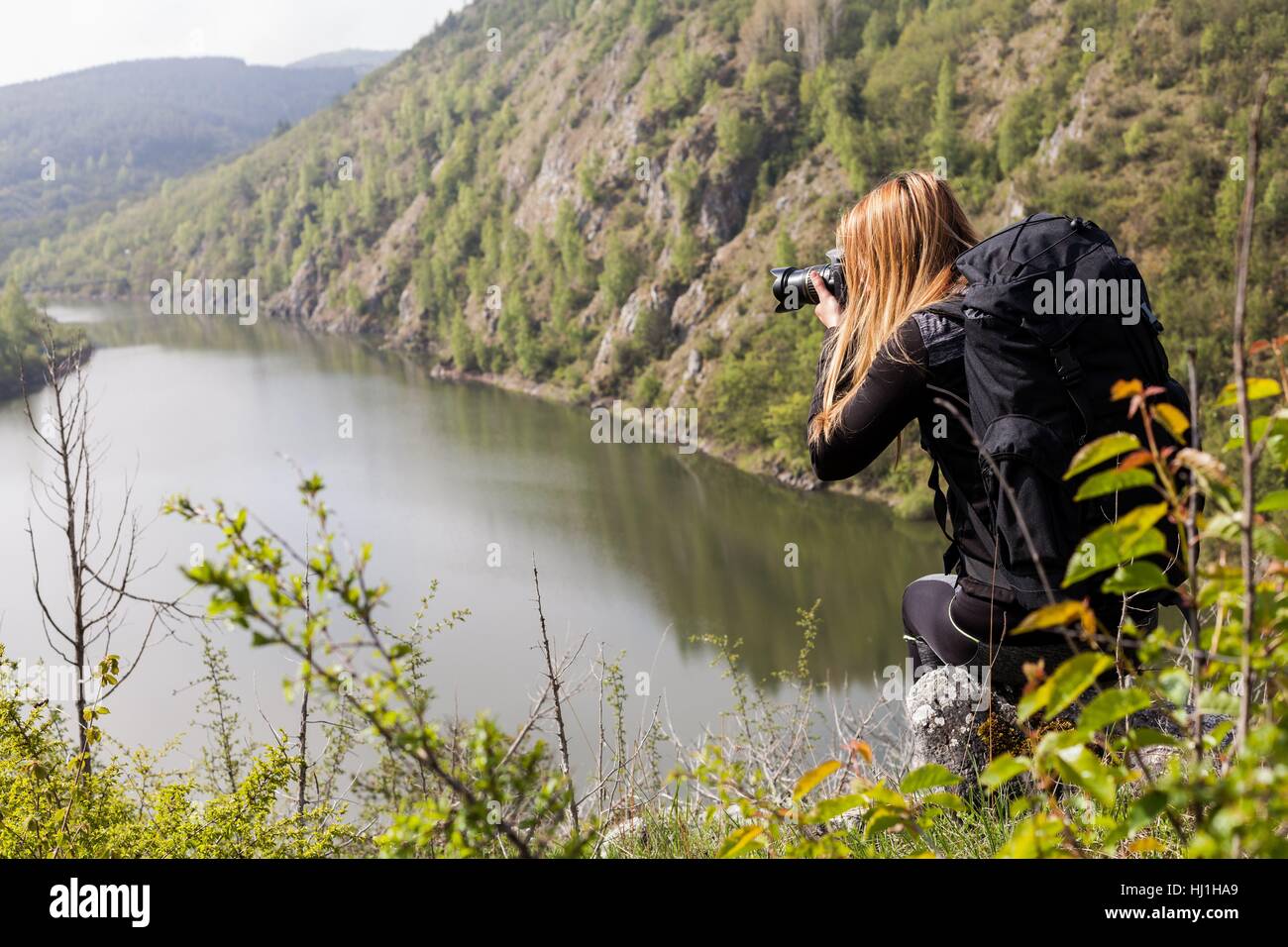 Young photographer shooting nature Stock Photo - Alamy