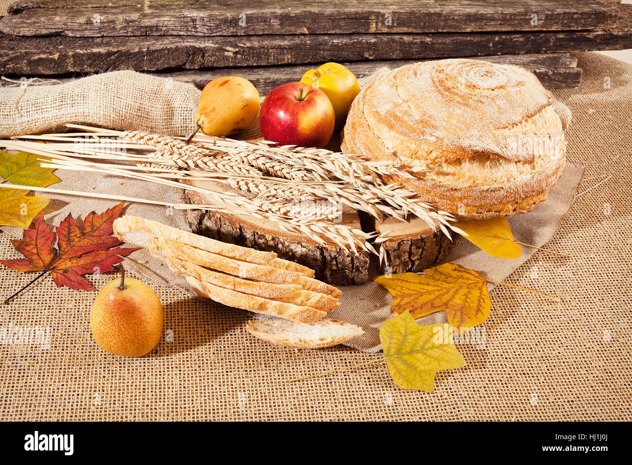 Decoration with bread, cereal and fruit on a linen background Stock ...