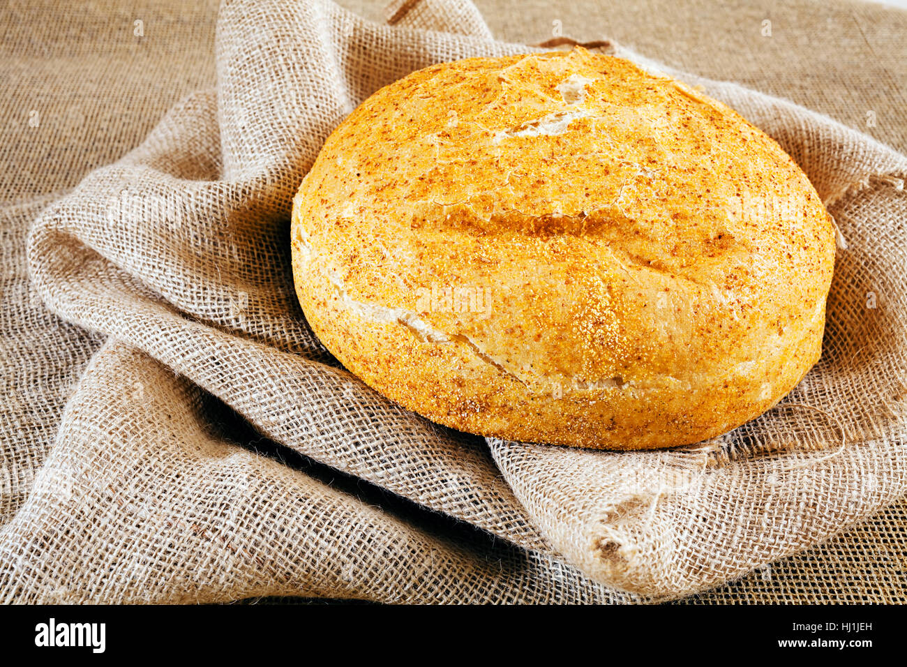 Round corn bread on a linen cloth, note shallow depth of field Stock ...