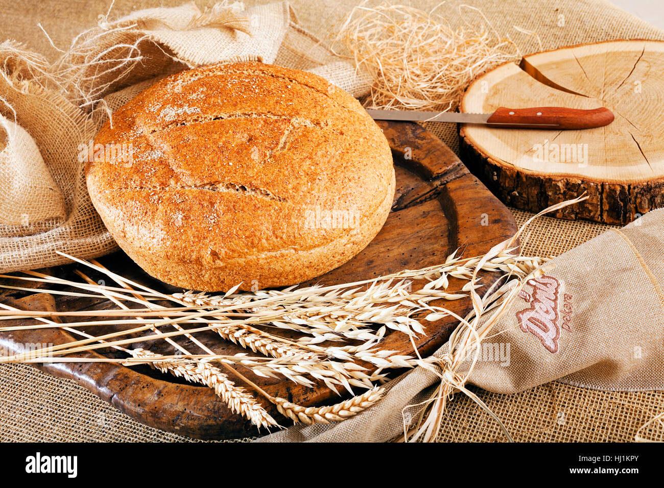 Decoration with round integral bread on wooden board, note shallow ...