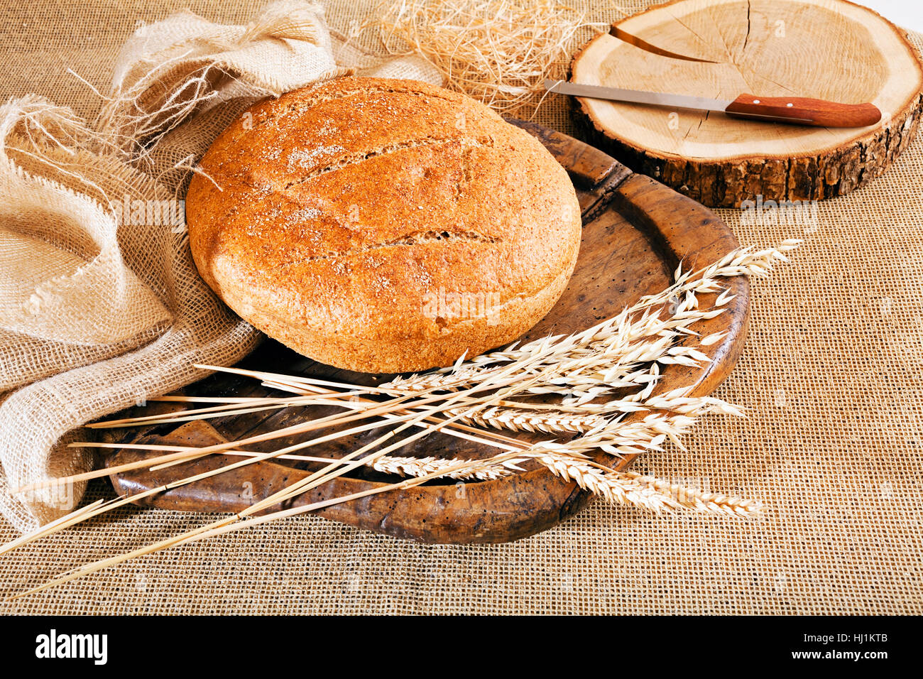 Decoration with round integral bread on wooden board, note shallow ...