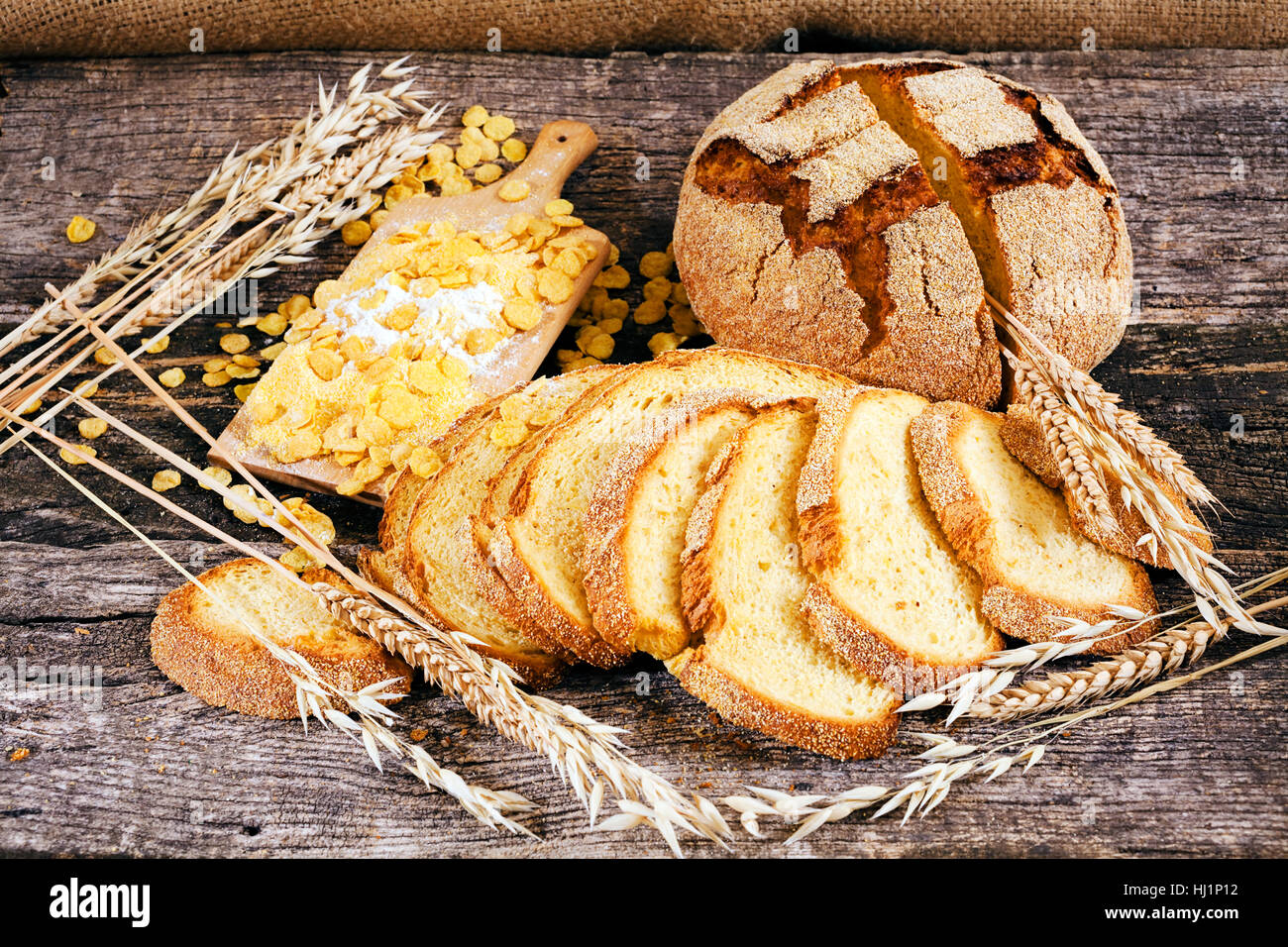 Decoration with corn bread and cereals on a wooden board, note shallow ...