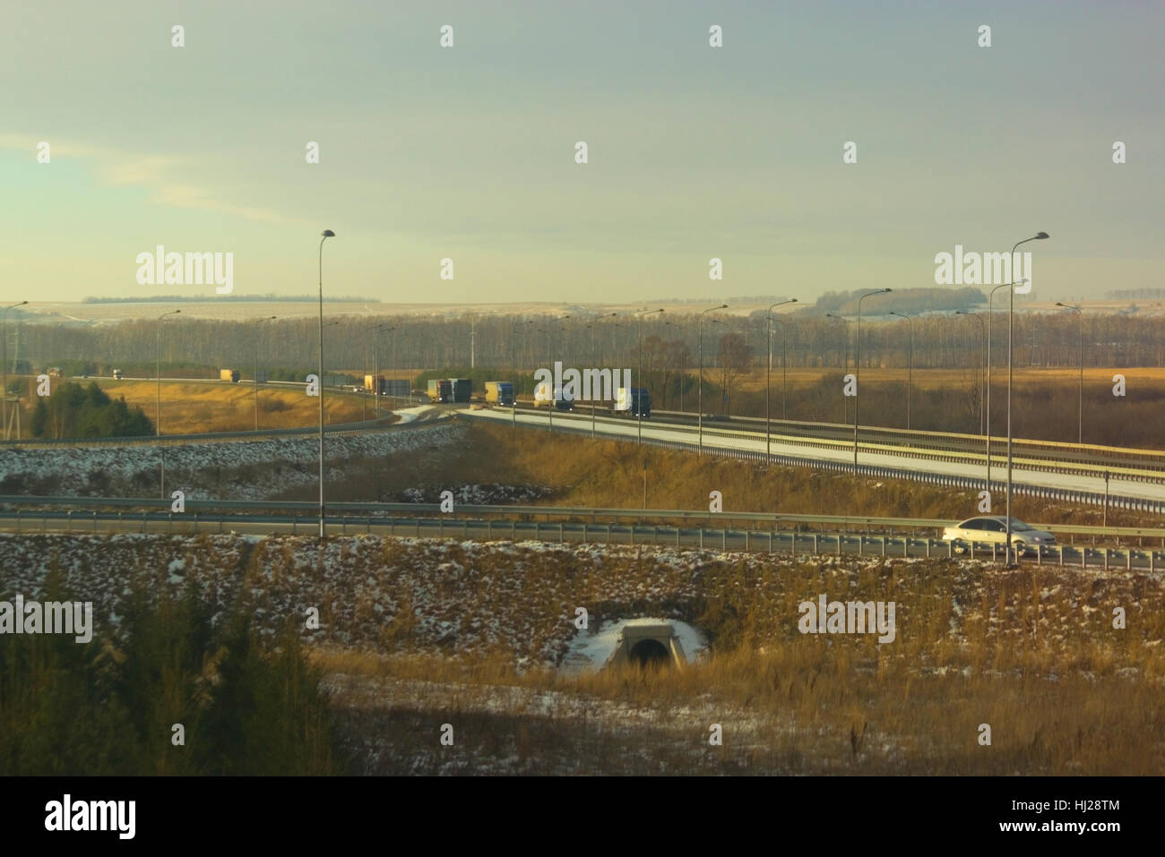 An image of a nice road with cars in the autumn scenery Stock Photo - Alamy