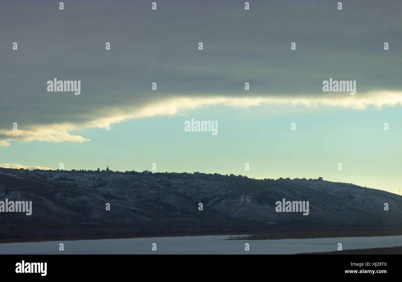 Frozen River and distant mountains, winter cold day Stock Photo - Alamy