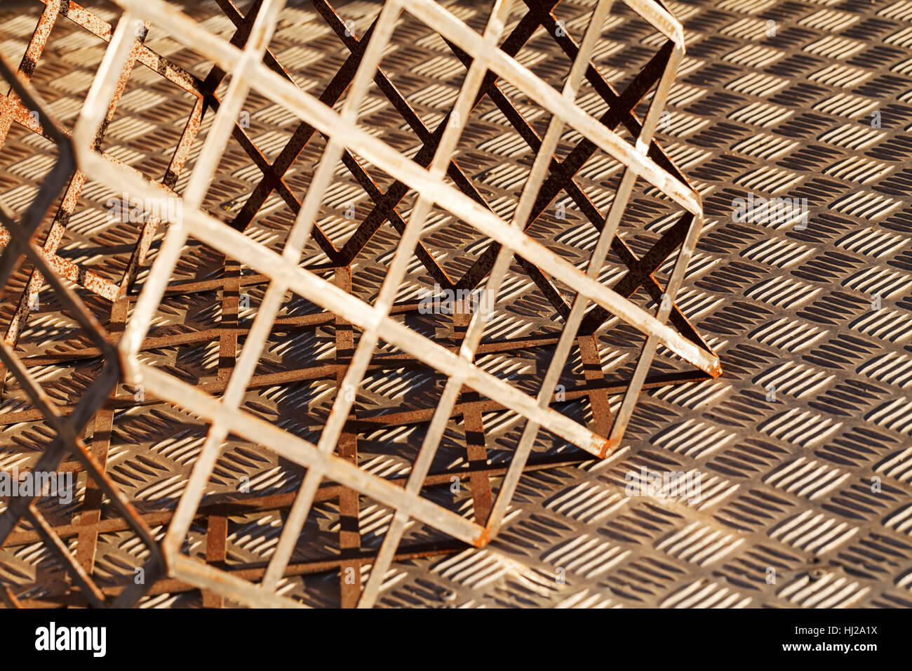 the shadow of the iron bars in construction, note shallow depth of ...