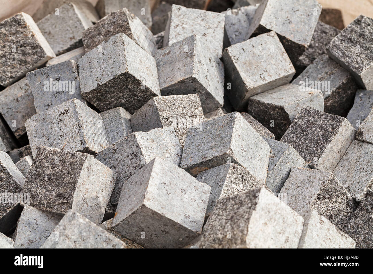 granite cubes in a pile, note shallow depth of field Stock Photo - Alamy