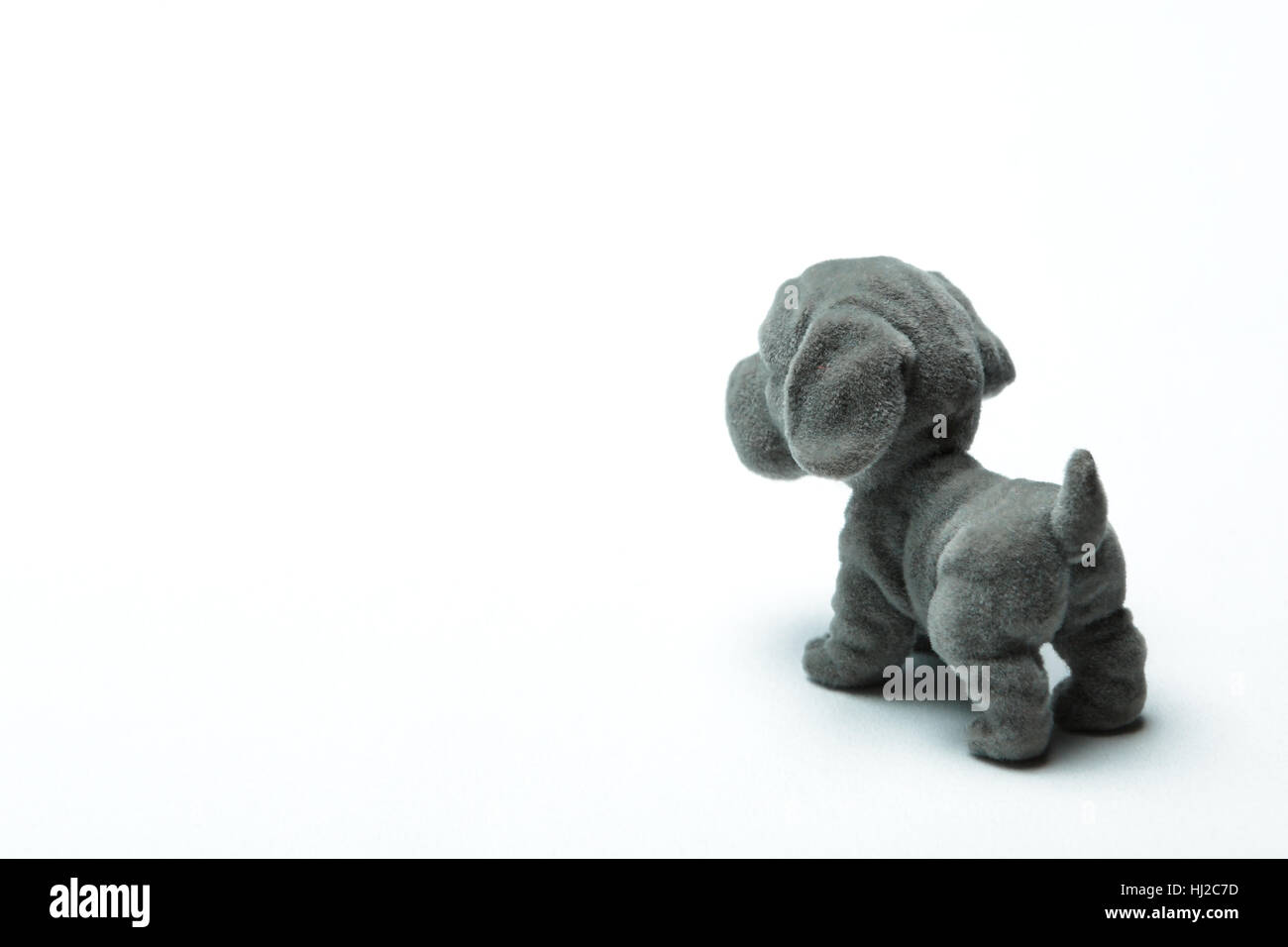 Toy of a dog on a light background Stock Photo - Alamy
