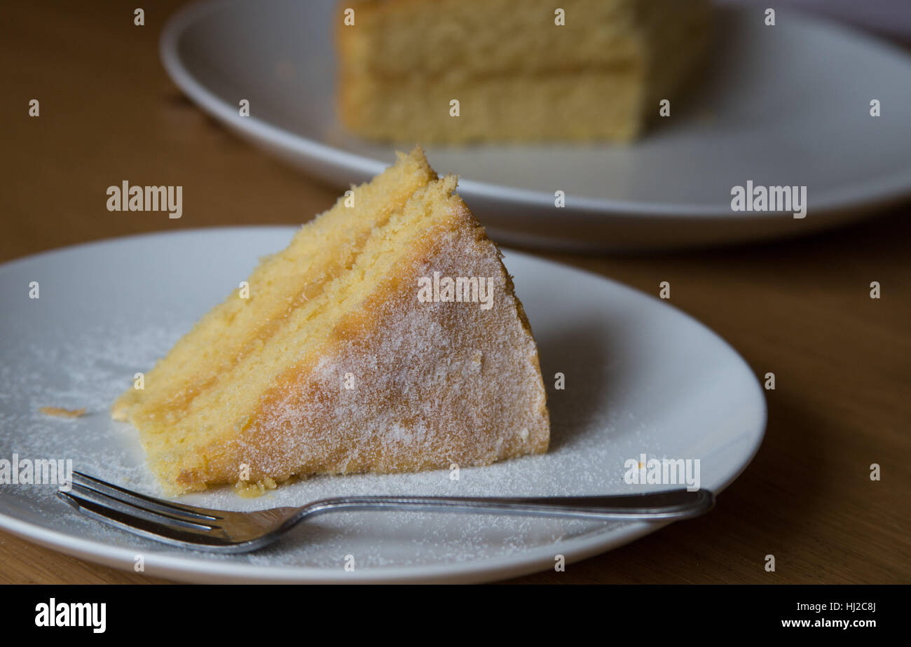 A slice of victoria sandwich sponge cake Stock Photo - Alamy