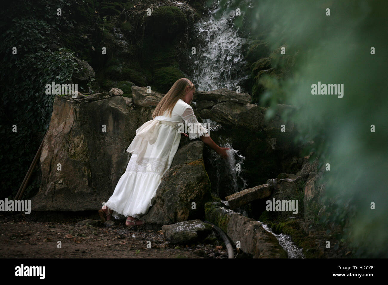 White princess wandering the woods Stock Photo - Alamy
