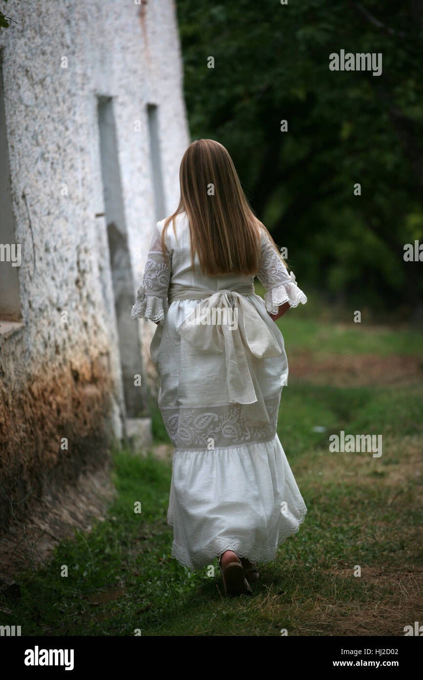 White princess wandering the woods Stock Photo - Alamy