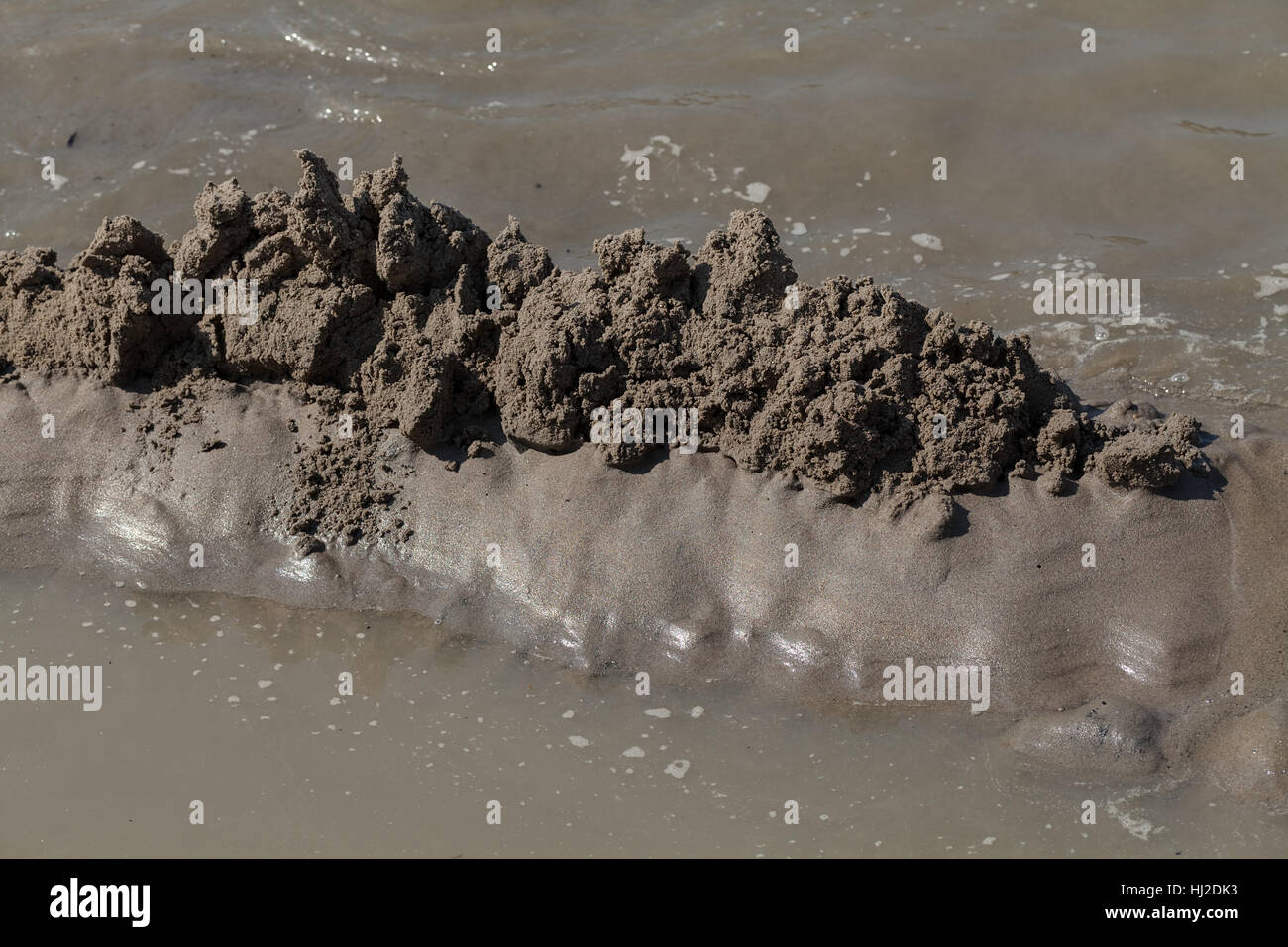 Mud on site after rain, note shallow depth of field Stock Photo - Alamy