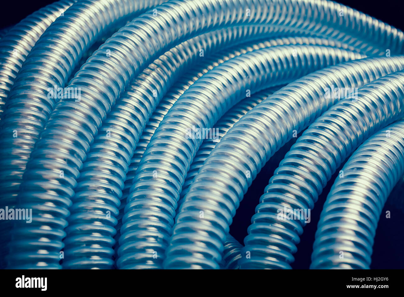 flexible blue plastic hose in construction Stock Photo - Alamy