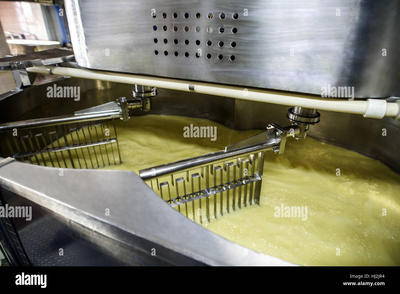 Equipment at dairy processing plant at work Stock Photo - Alamy
