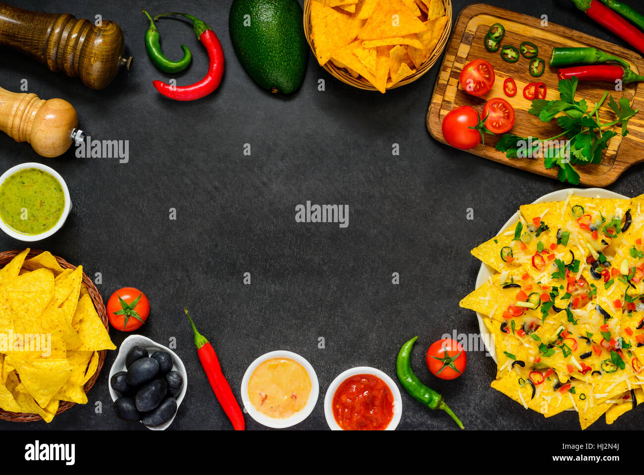 Copy Space Frame with Tortilla Chips, Ingredients and Dip Stock Photo ...