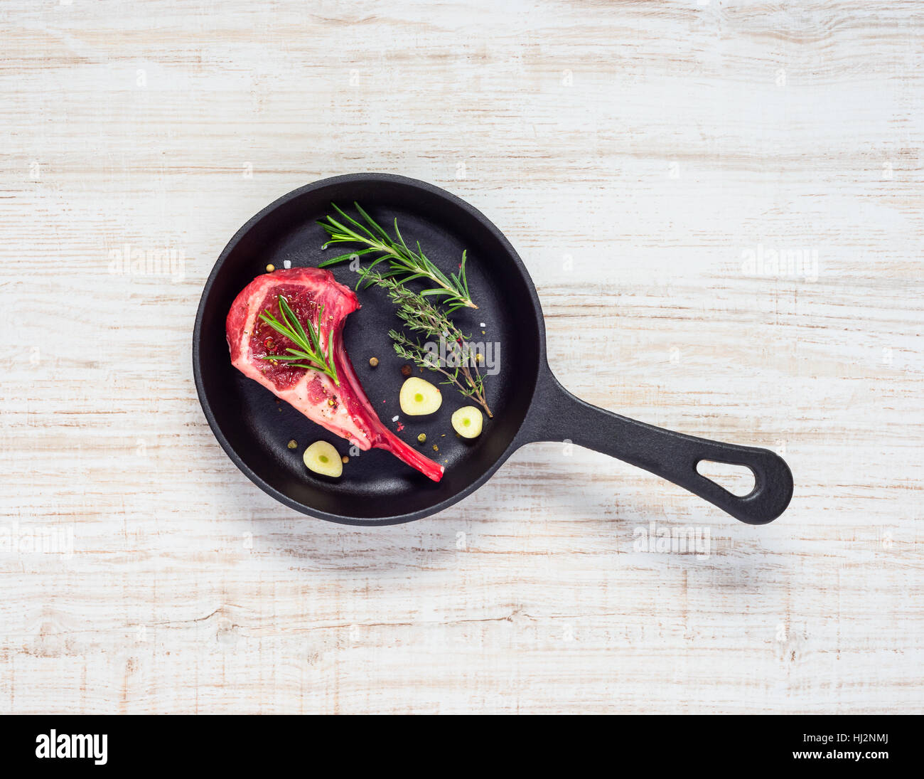 Top View of Lamb Chop in Frying Pan with Spices and Cooking Herbs Stock ...