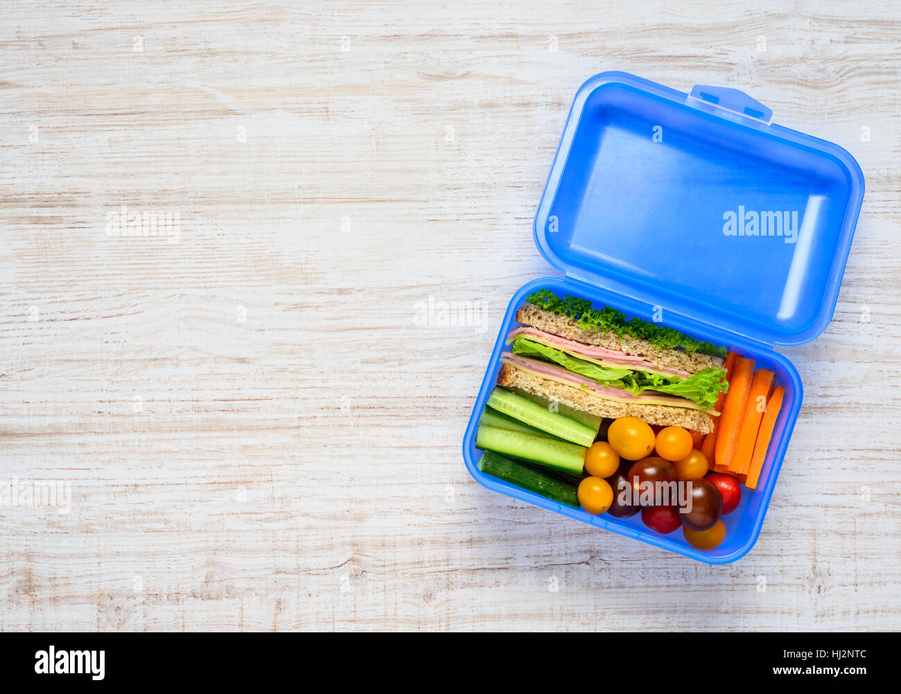 Top View of Blue Lunch Box with Food inside, Sandwich and Vegetables ...