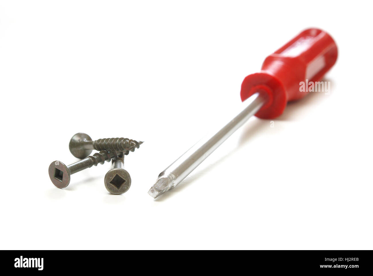 A square-head screwdriver with square-head screws on a white background ...