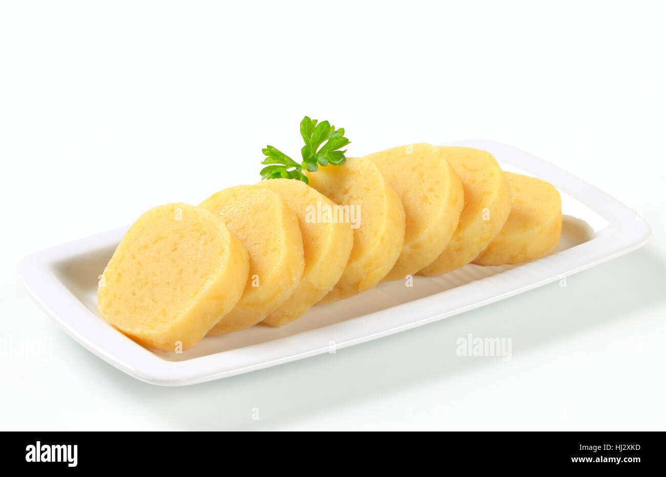 Cooked potato dumpling cut into slices Stock Photo - Alamy