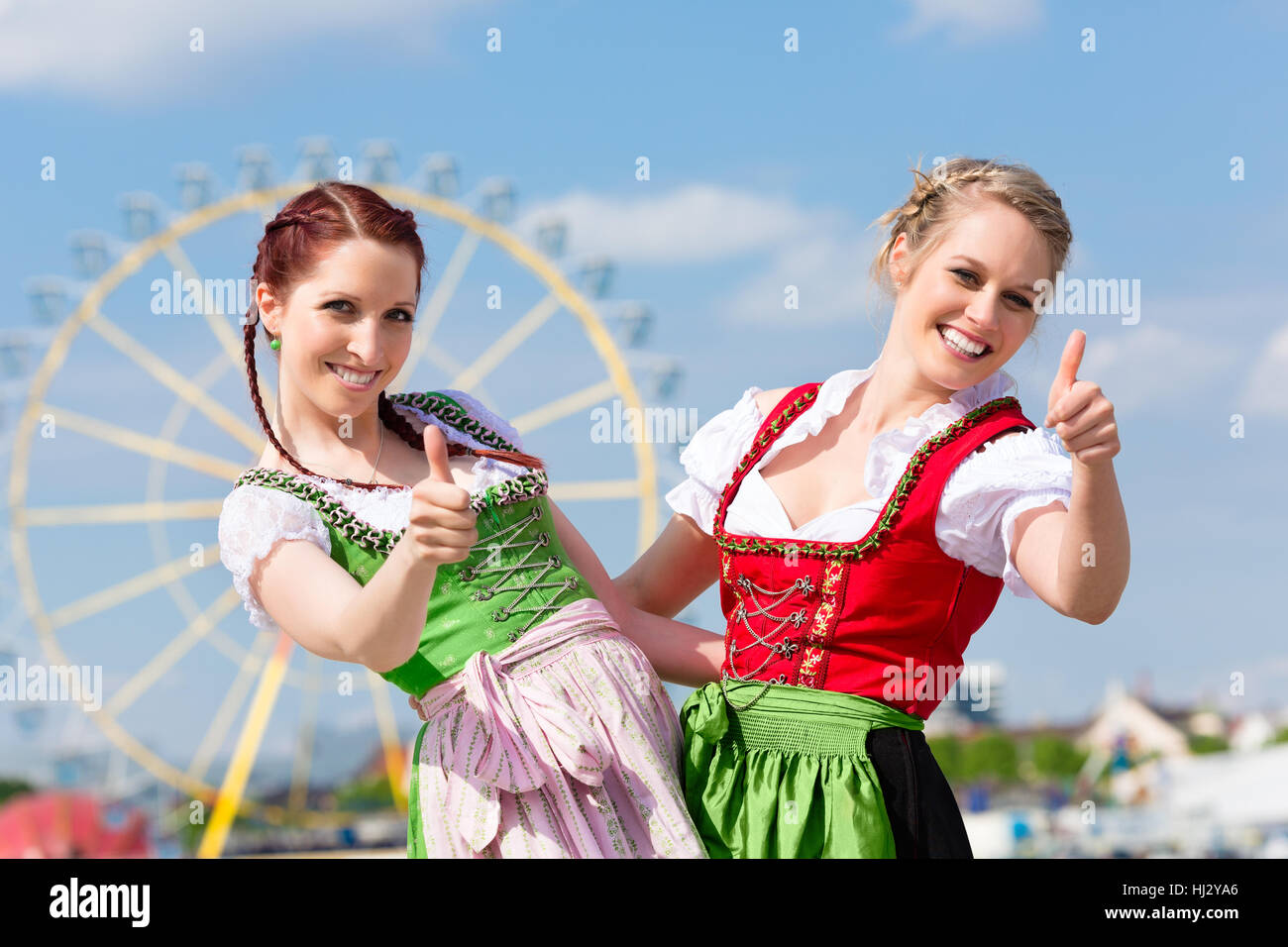 young women at the spring festival in a traditional dirndl Stock Photo ...