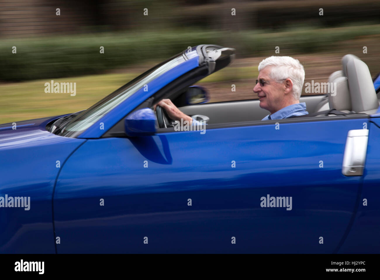 Senior Man Driving Late Model Sports Car Convertible, USA Stock Photo ...