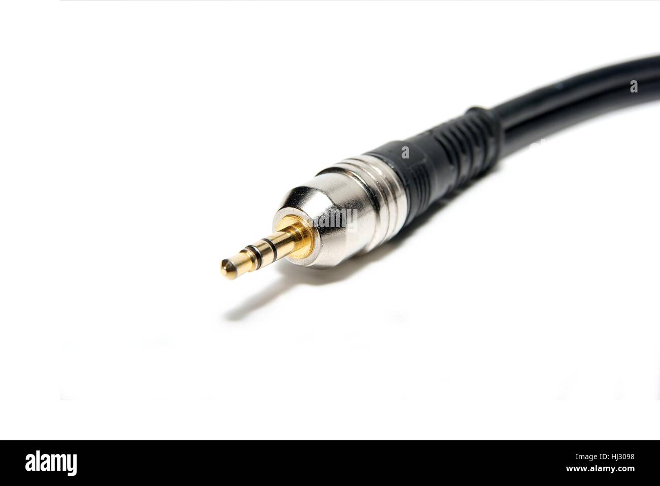 3.5mm gold plated jack plug isolated on white Stock Photo - Alamy