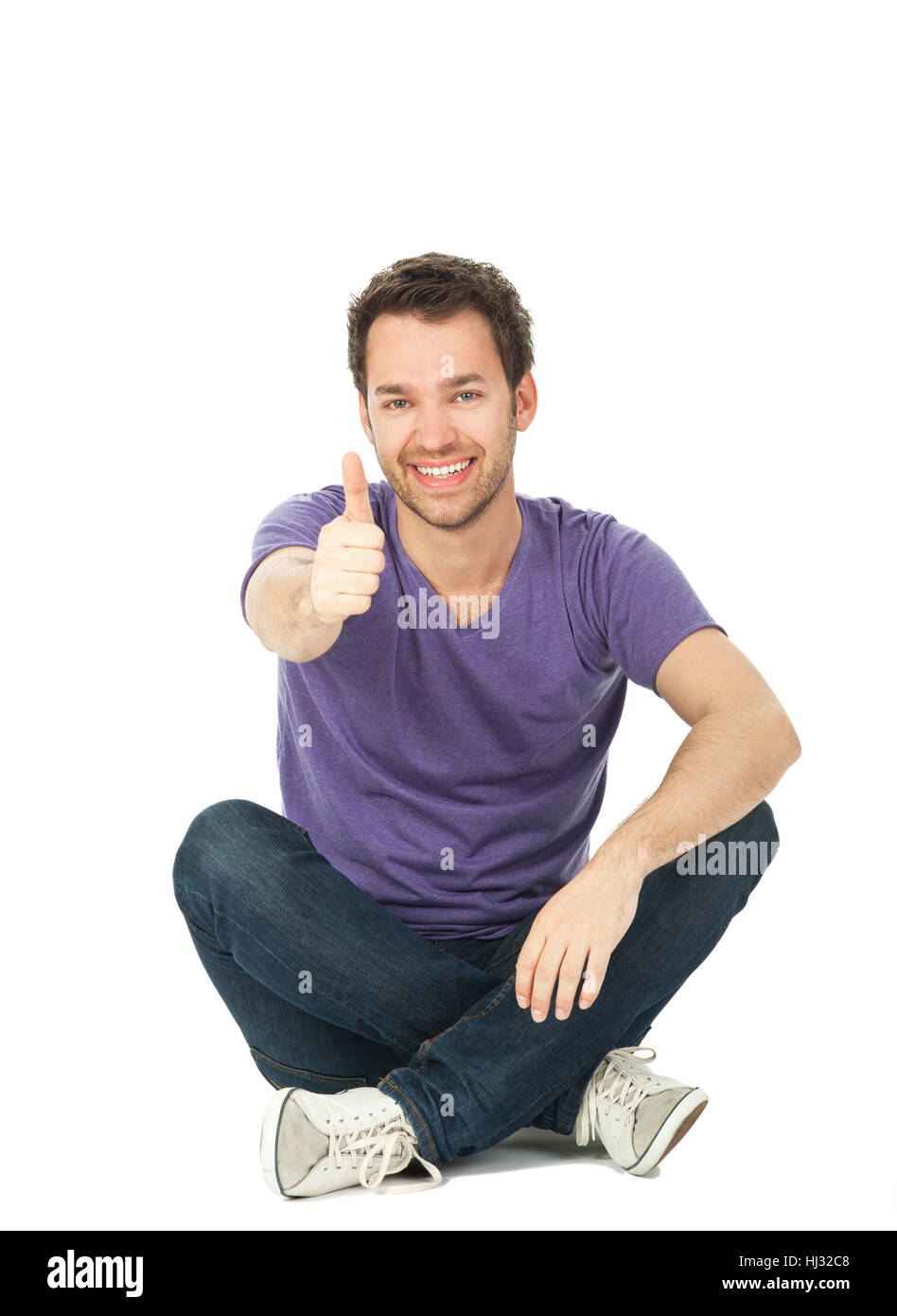 young man sitting Stock Photo - Alamy