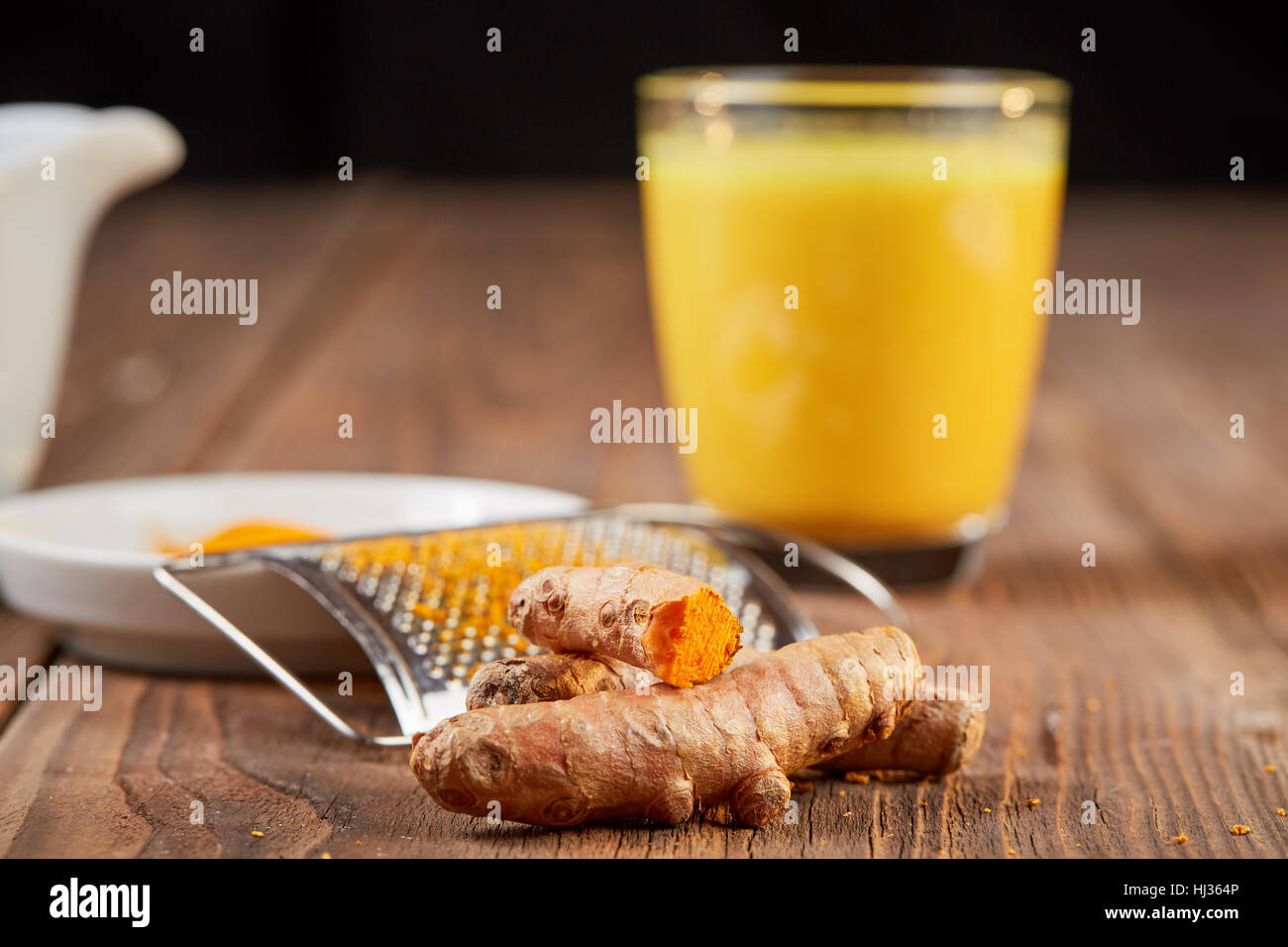 Tumeric curcuma root healthy golden orange powder Stock Photo - Alamy