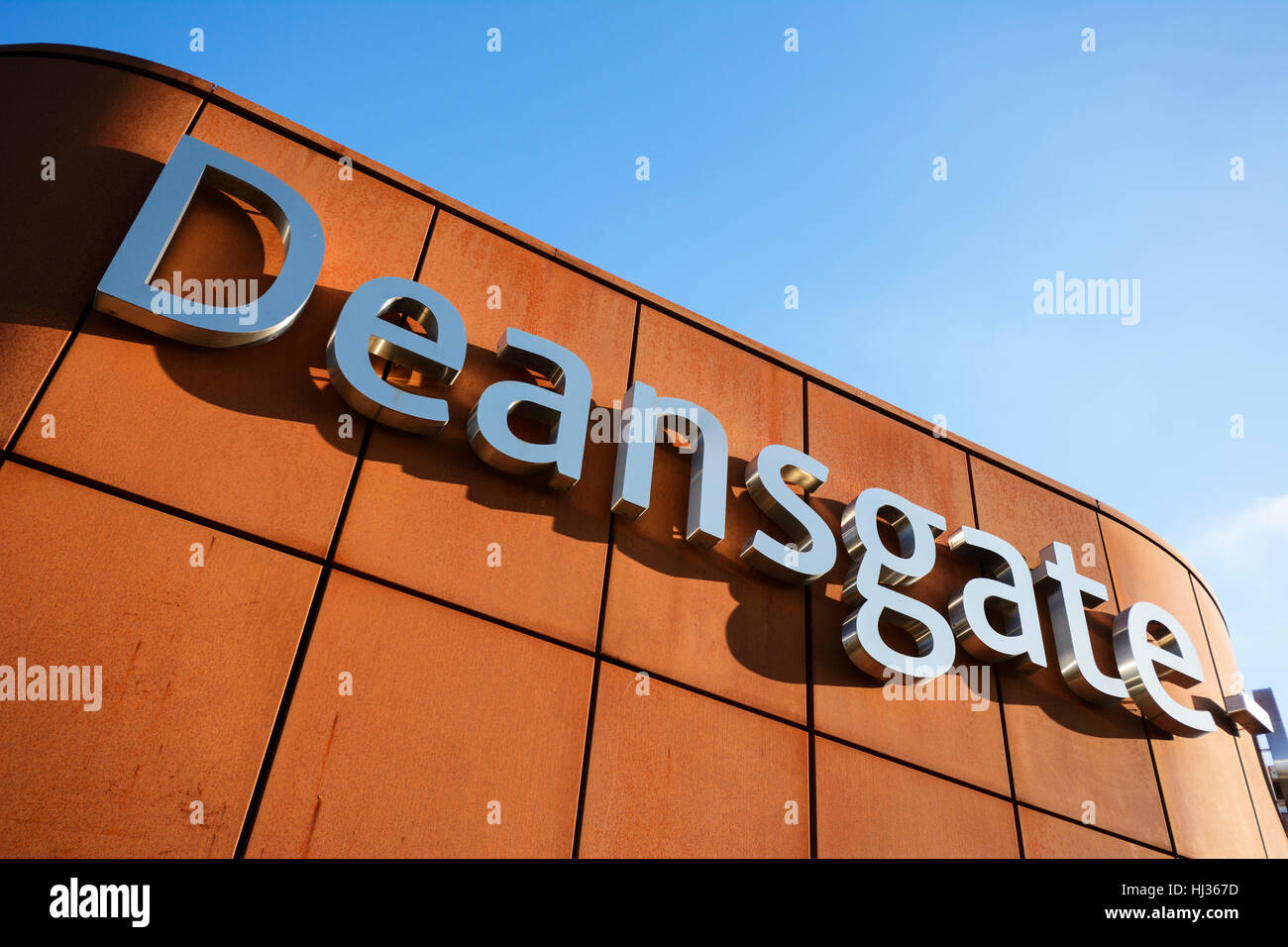 Chrome Deansgate sign on a rusty structure at Deansgate Metrolink tram ...