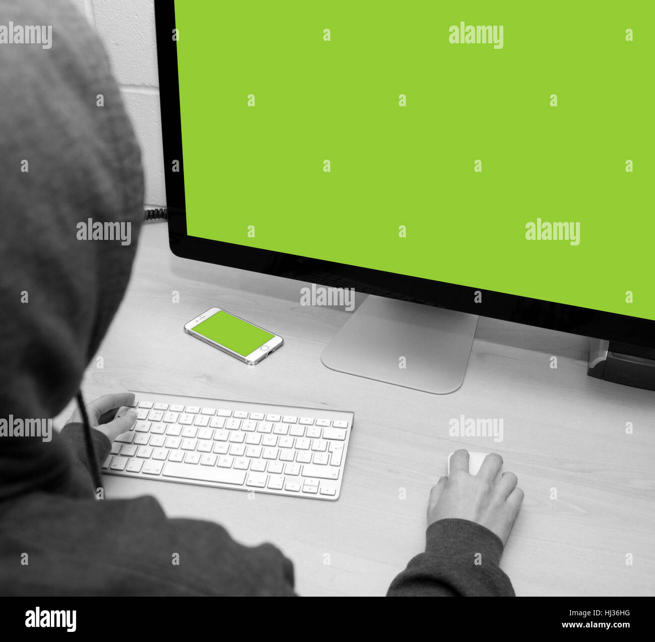 Person sat at a computer ready to work, hack, steal money, create, type ...