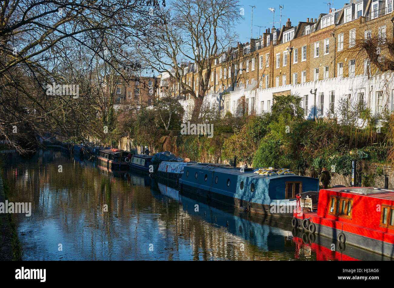 Regents Canal at Islington, North London UK, in winter, with narrowboats and terreced houses ...