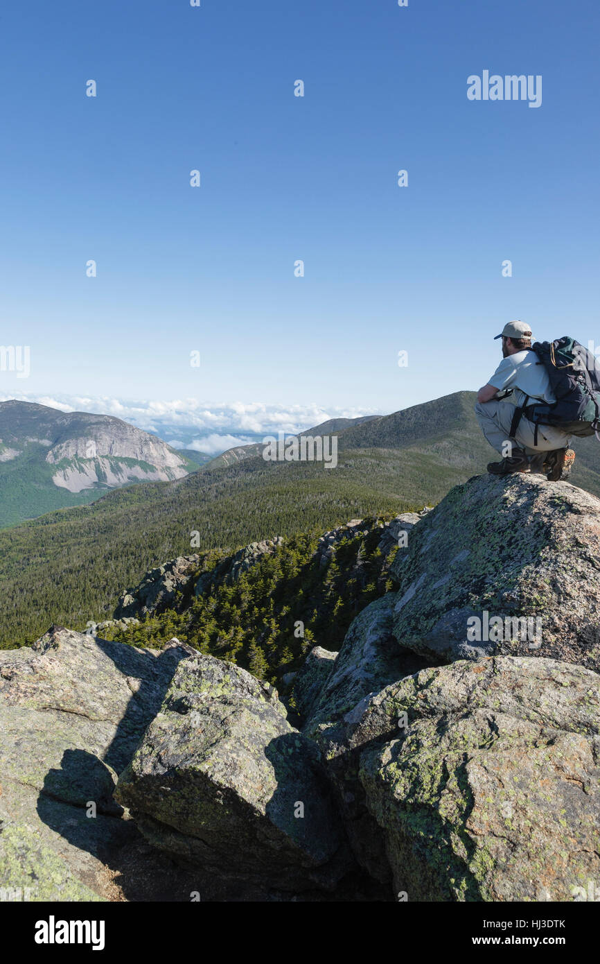 A hiker on the summit of Mount Liberty in the White Mountains, New ...