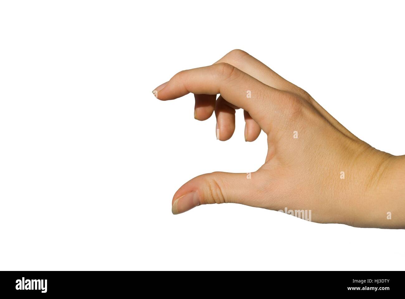 a young european looking hand shows something little or big between its ...