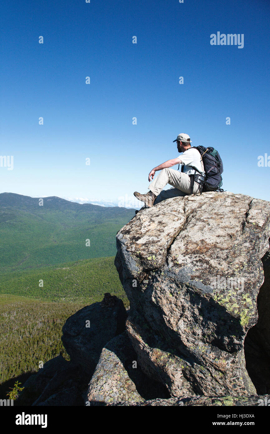 A hiker on the summit of Mount Liberty in the White Mountains, New ...